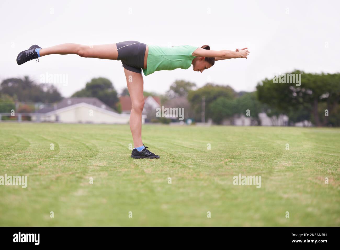 Female athlete stretching on field hi-res stock photography and images ...