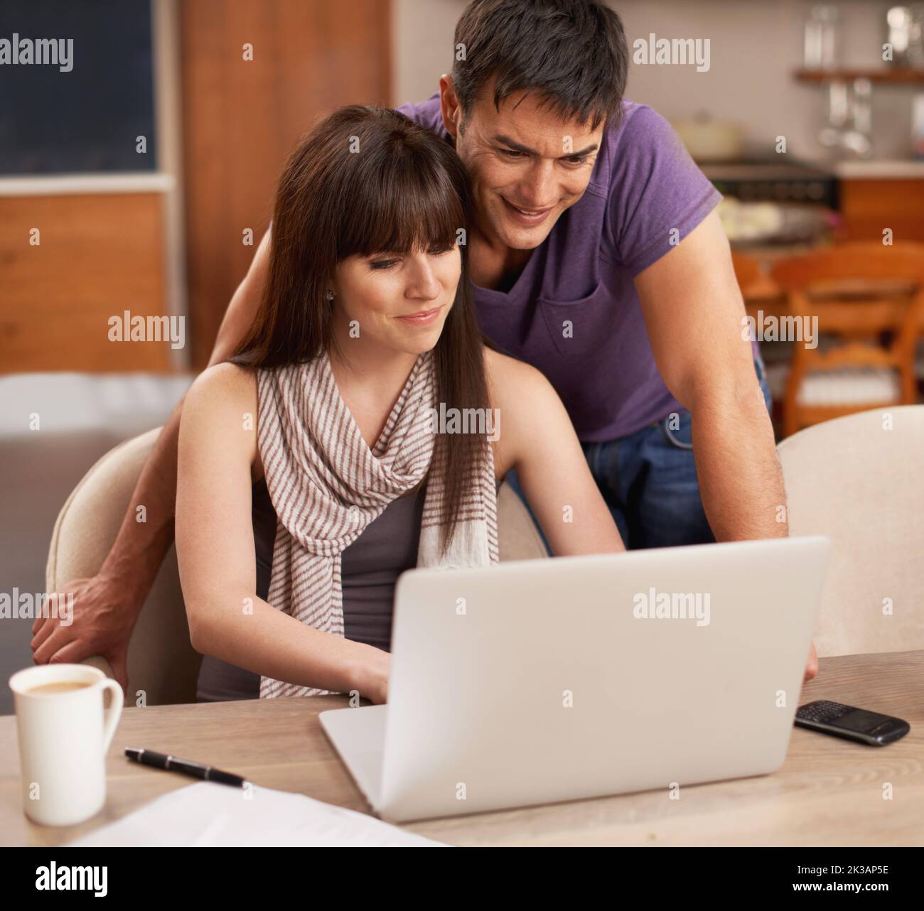 Doing the budget. a young couple doing their finances at home Stock ...