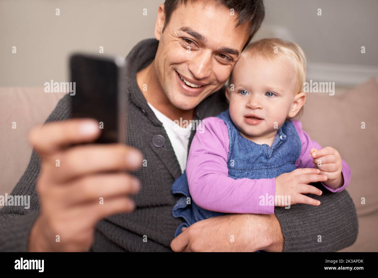 Snap - father and daughter photo. A father taking a self-portrait of ...