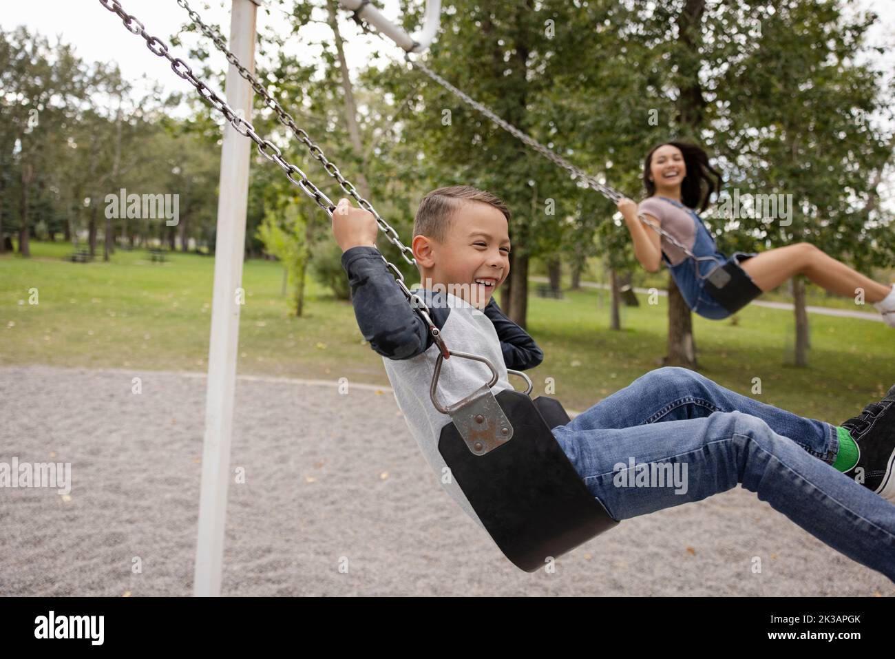 Boy girl brother sister playground hi-res stock photography and images - Alamy