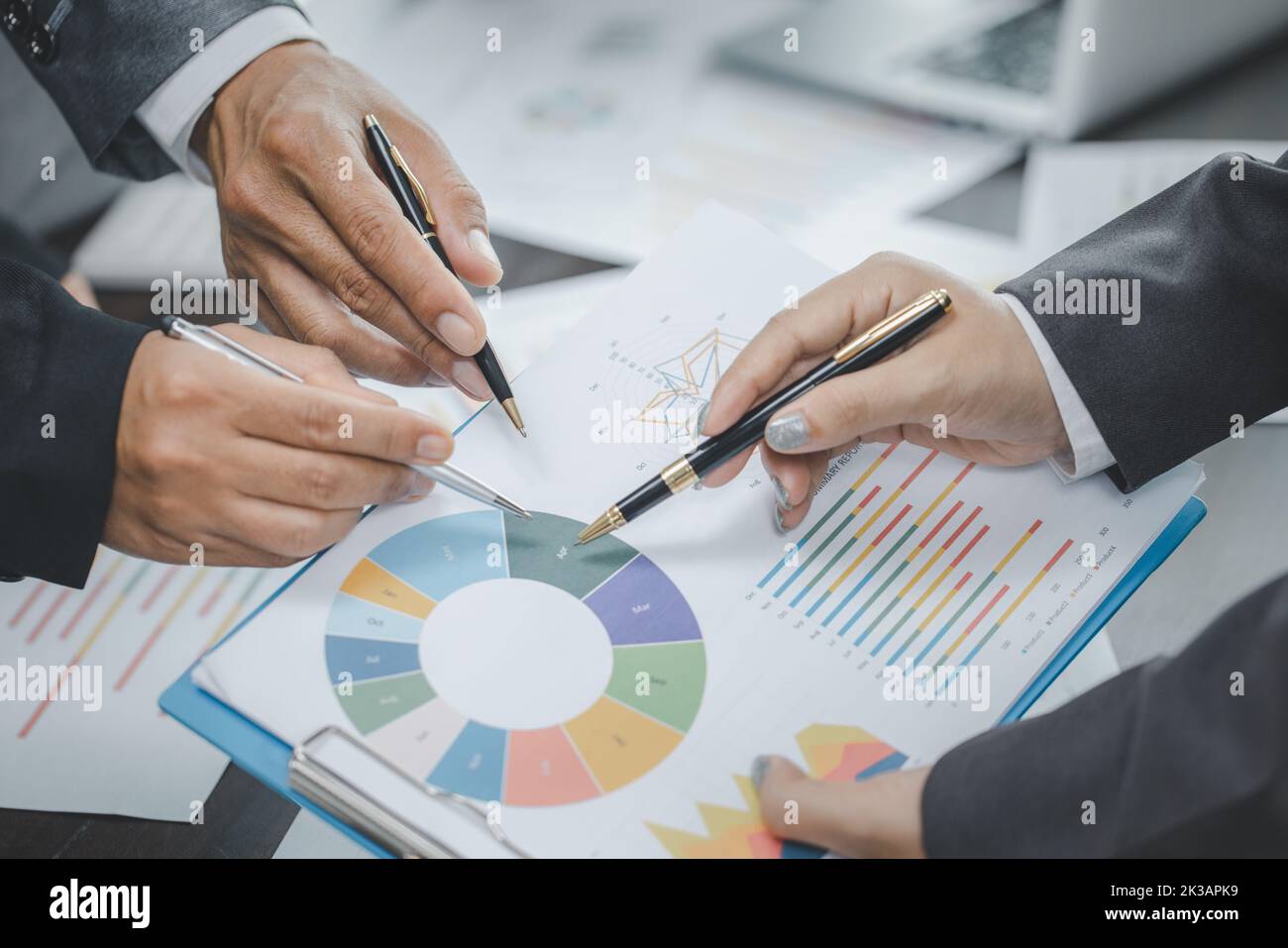 Team business meeting presentation, Business people discussing the charts and graphs showing the ...