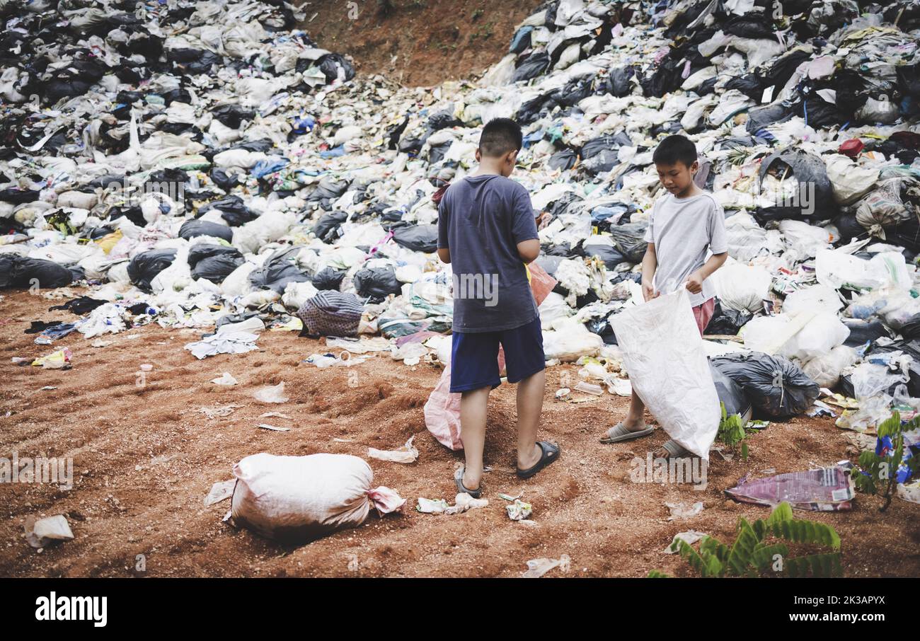 child walk to find junk for sale and recycle them in landfills, the ...