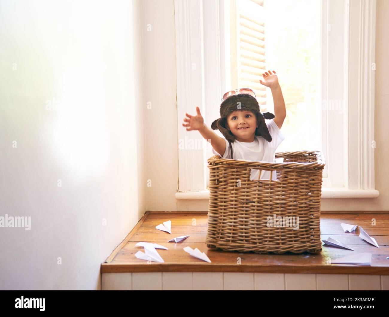 Fly high and touch the sky. an adorable little boy sitting playing in a ...