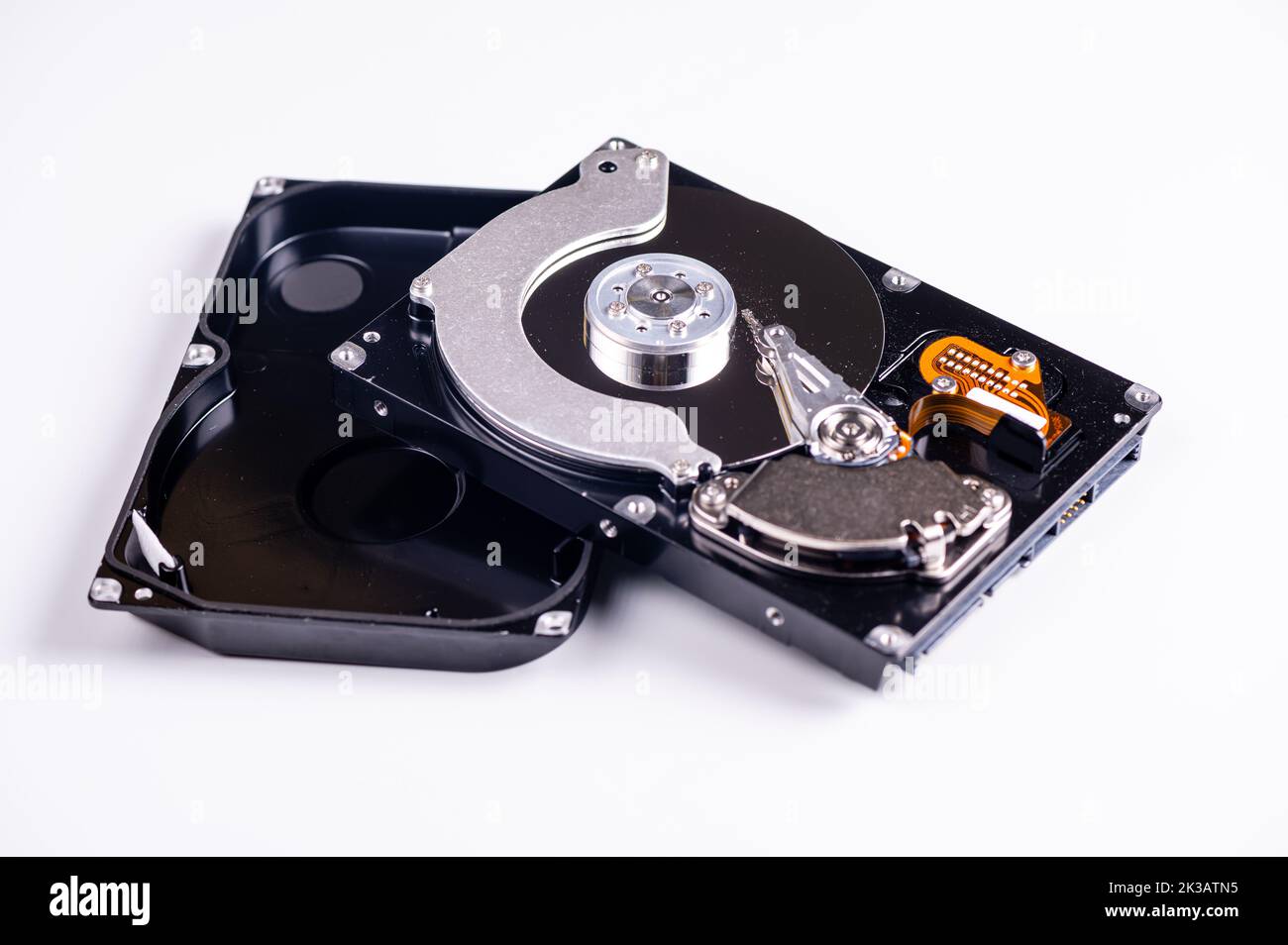 internal parts of a hard disk isolated on a white background, closeup ...