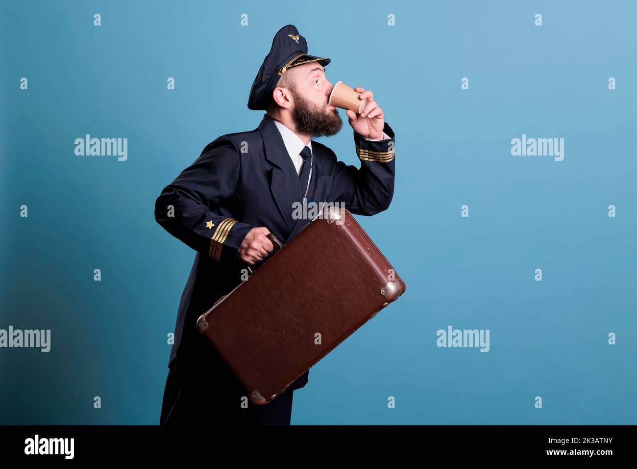 Airline pilot in uniform drinking hi-res stock photography and images ...