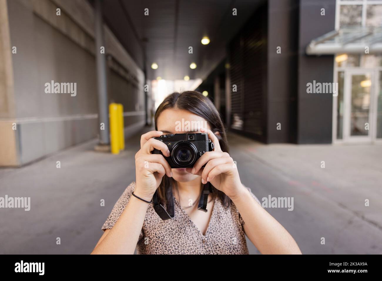 Girl standing in an alley hi-res stock photography and images - Alamy