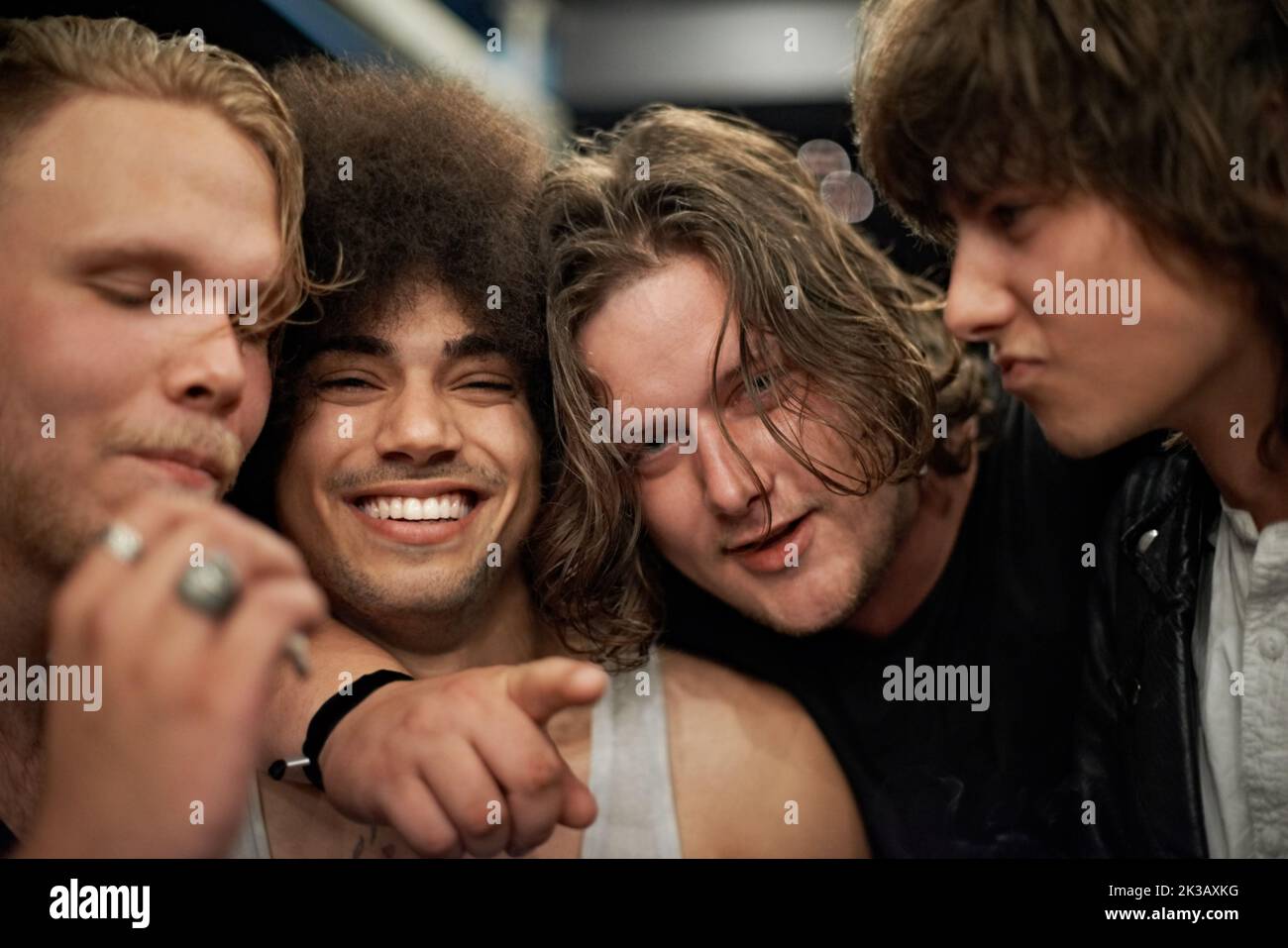 The best way to get in the mood...Cropped portrait of four young male ...