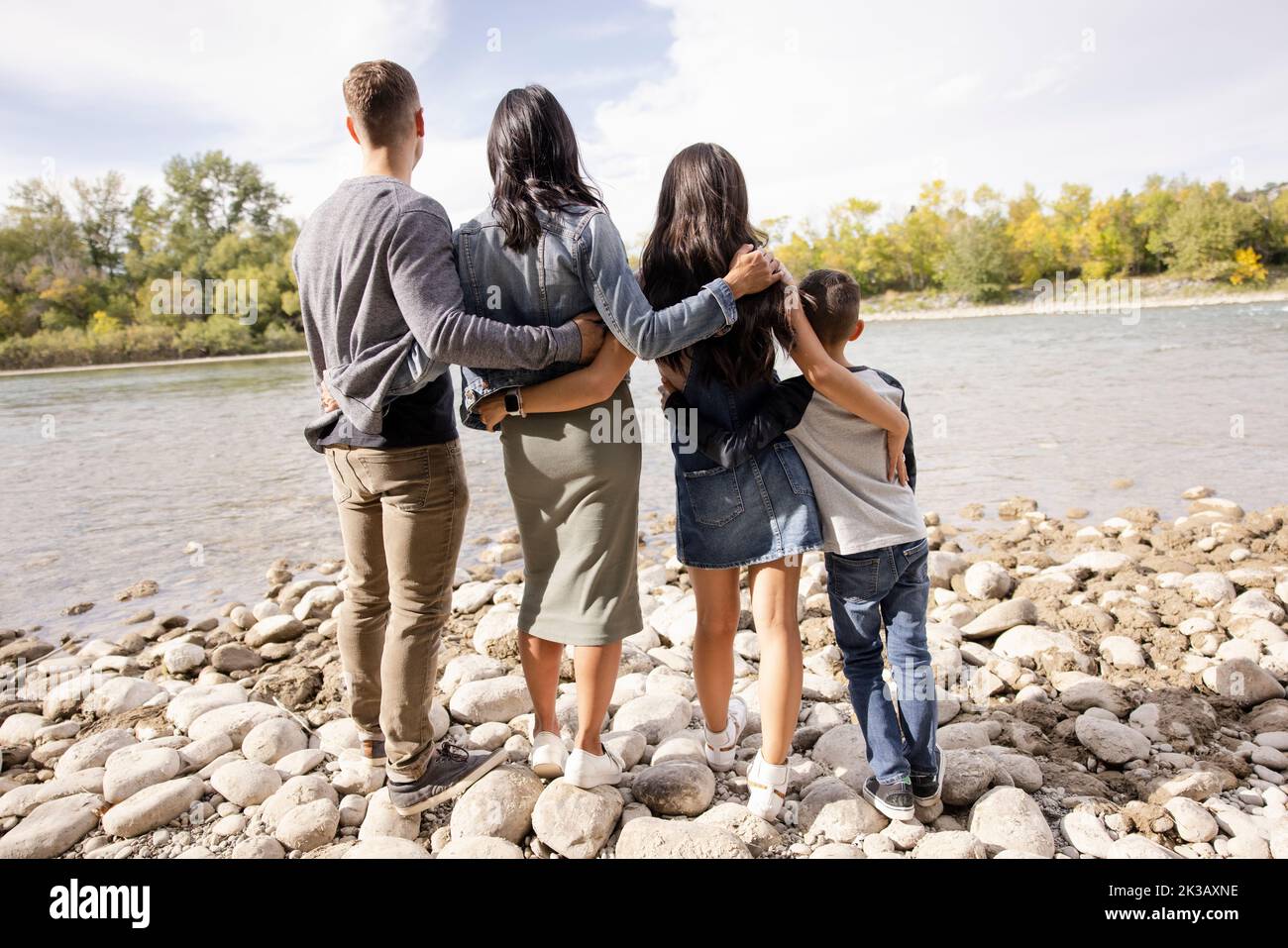 Happy family hugging hi-res stock photography and images - Alamy
