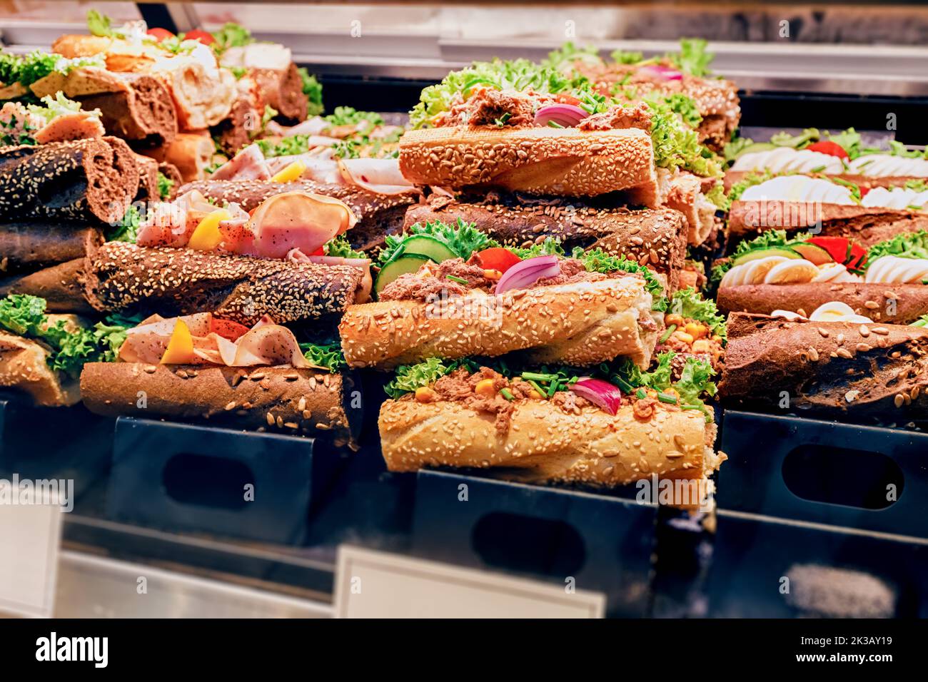 An assortment of sandwiches with various fillings are sold in the ...