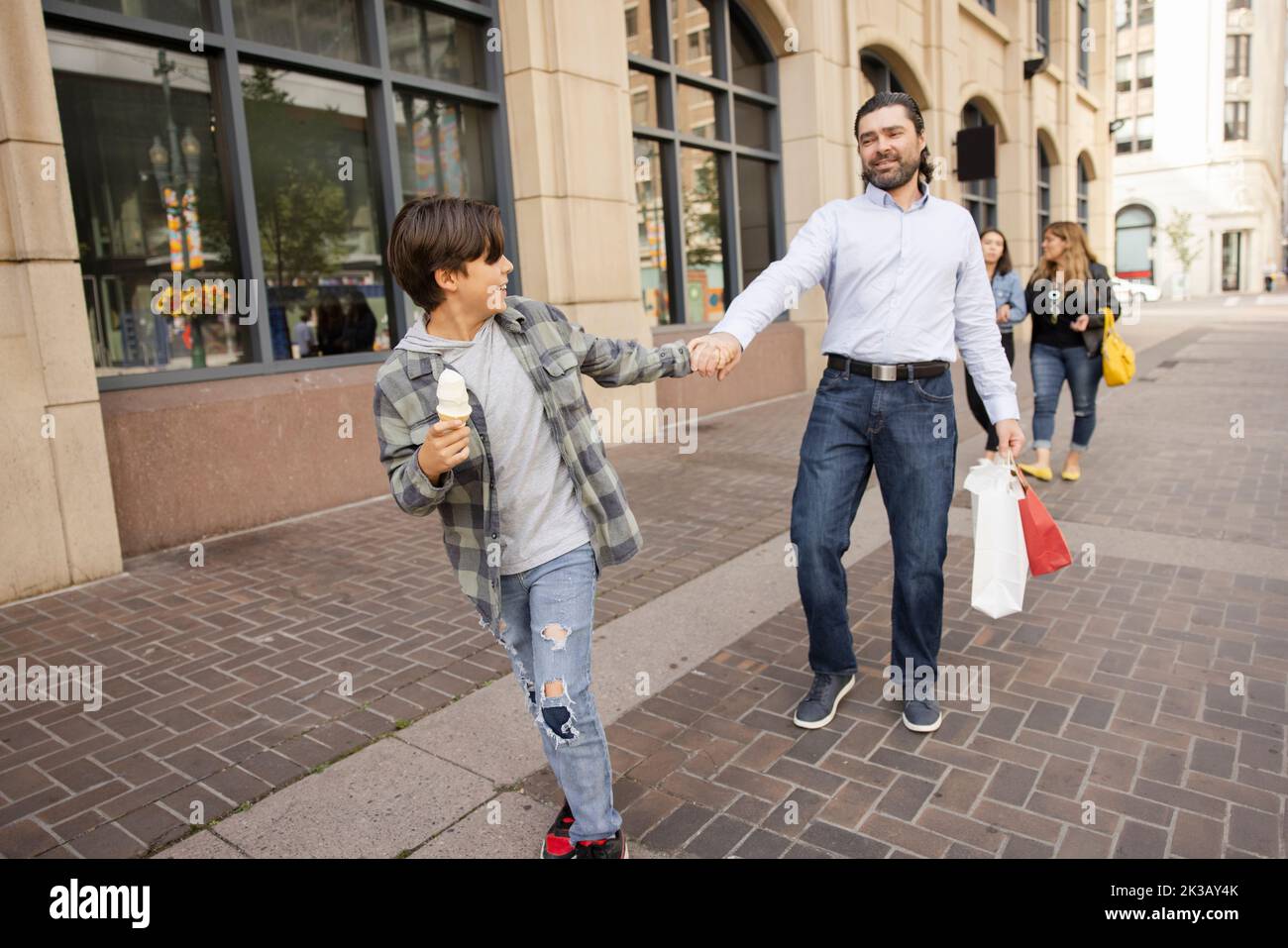 Boy pulling a bag hi-res stock photography and images - Alamy