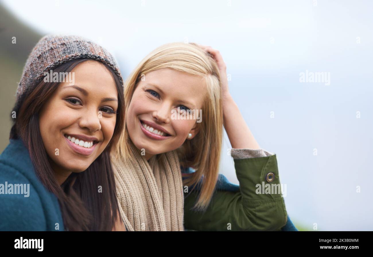 Precious moments with my best friend. Two young women sitting together ...