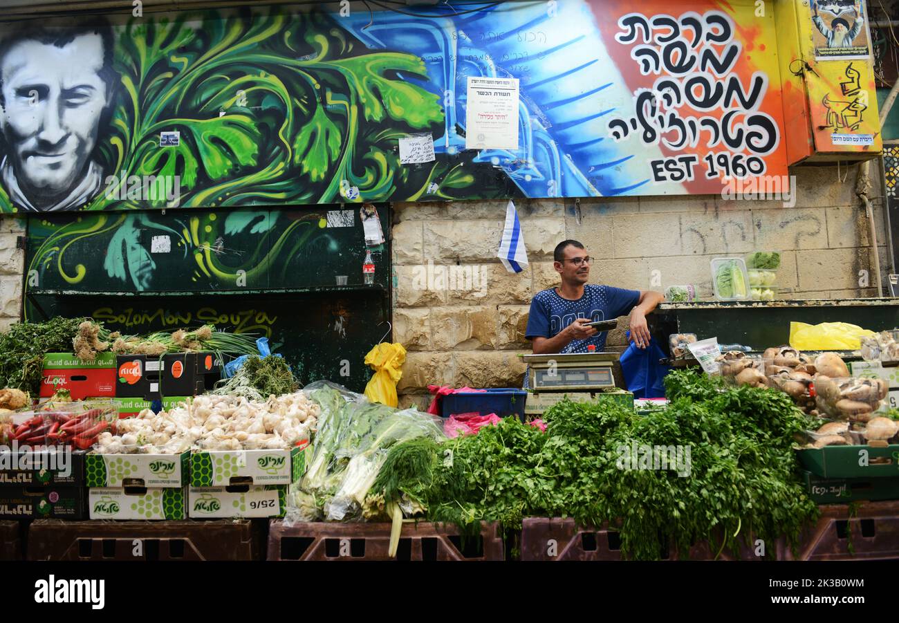 A colorful herb vendor at the Machane Yehuda market in Jerusalem ...