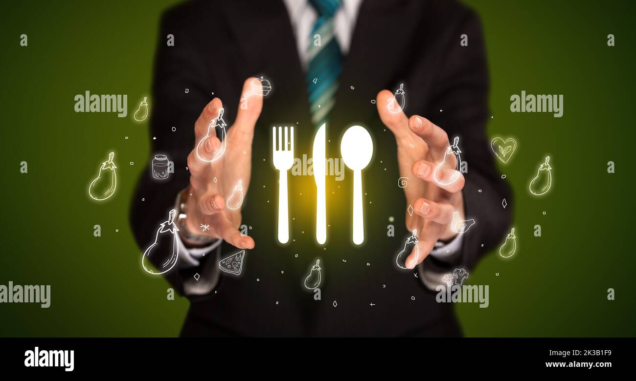 Hand holding food related icons Stock Photo - Alamy