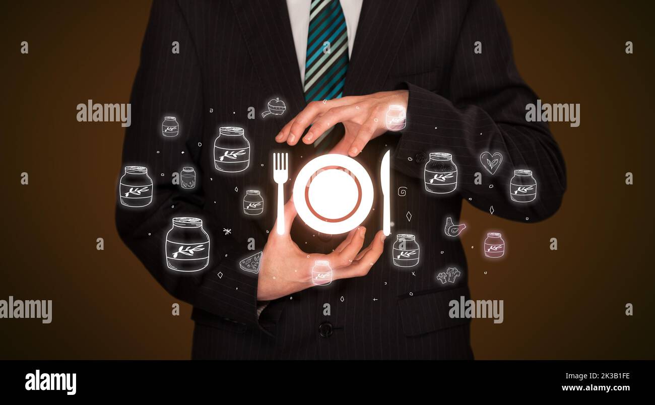 Hand holding food related icons Stock Photo - Alamy