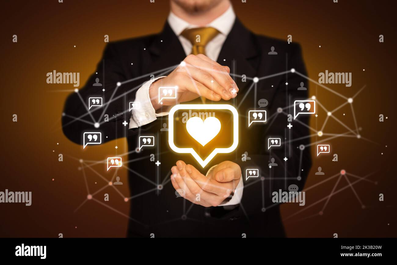 Hand holding social media icons Stock Photo - Alamy
