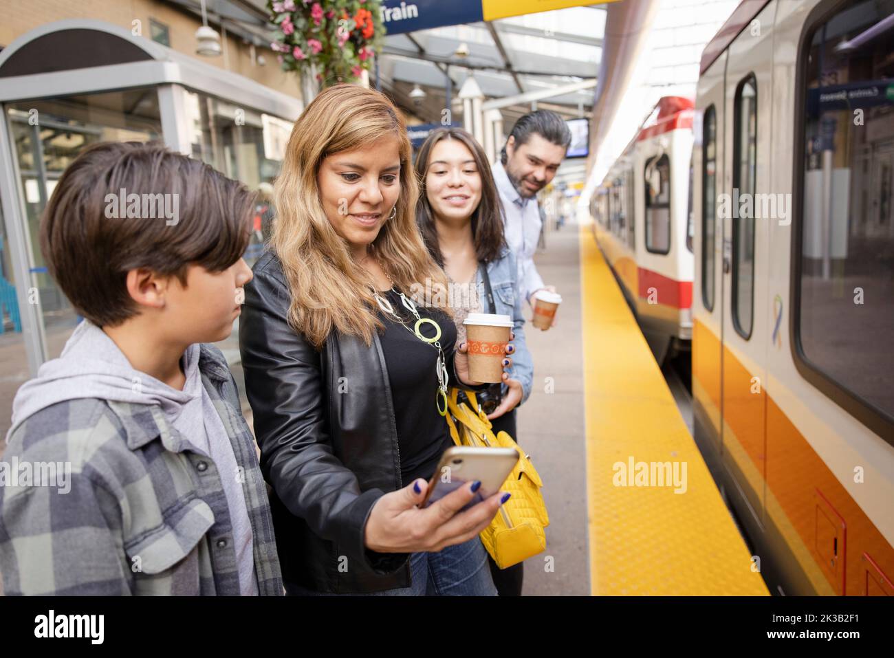 Family on train cell phone or mobile hi-res stock photography and ...