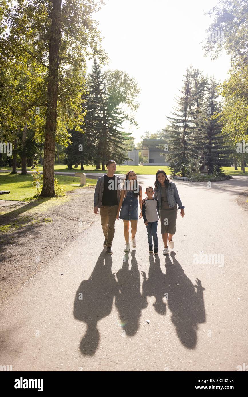 Happy asian family walking outdoors hi-res stock photography and images ...