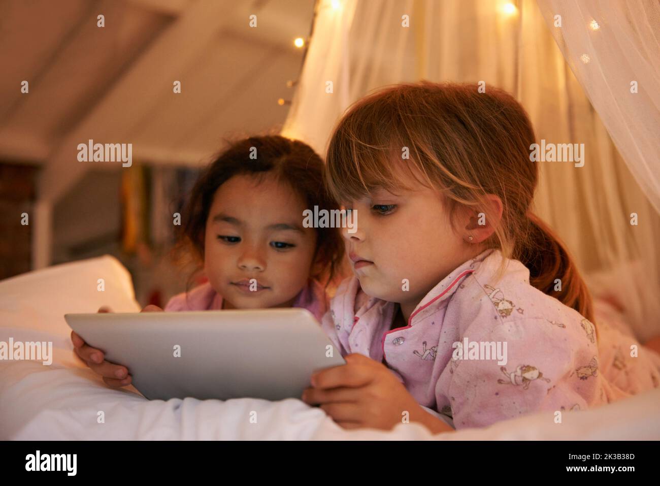 I LOVE sleepovers. two cute little girls having a sleepover and reading ...