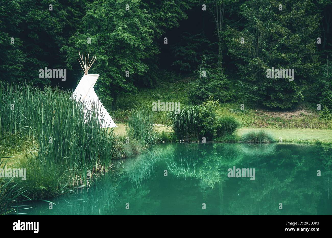 white teepee indian tent standing in beautiful landscape Stock Photo ...