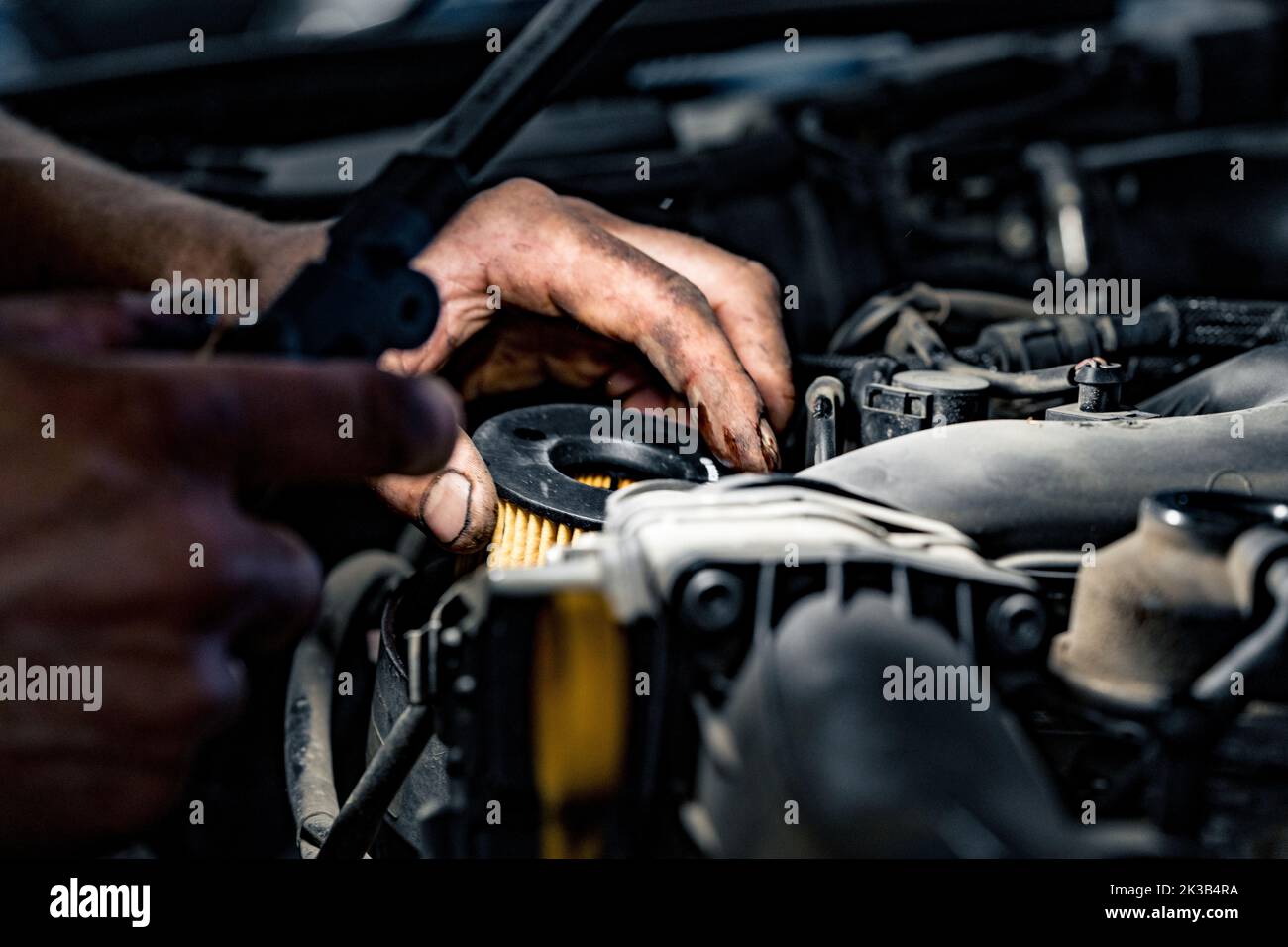 Close up of auto mechanic repairing car engine in car service Stock ...