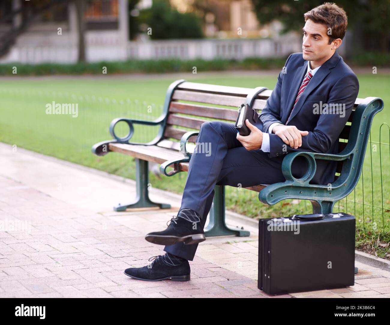 Taking a breather from the office. A thoughtful-looking businessman ...