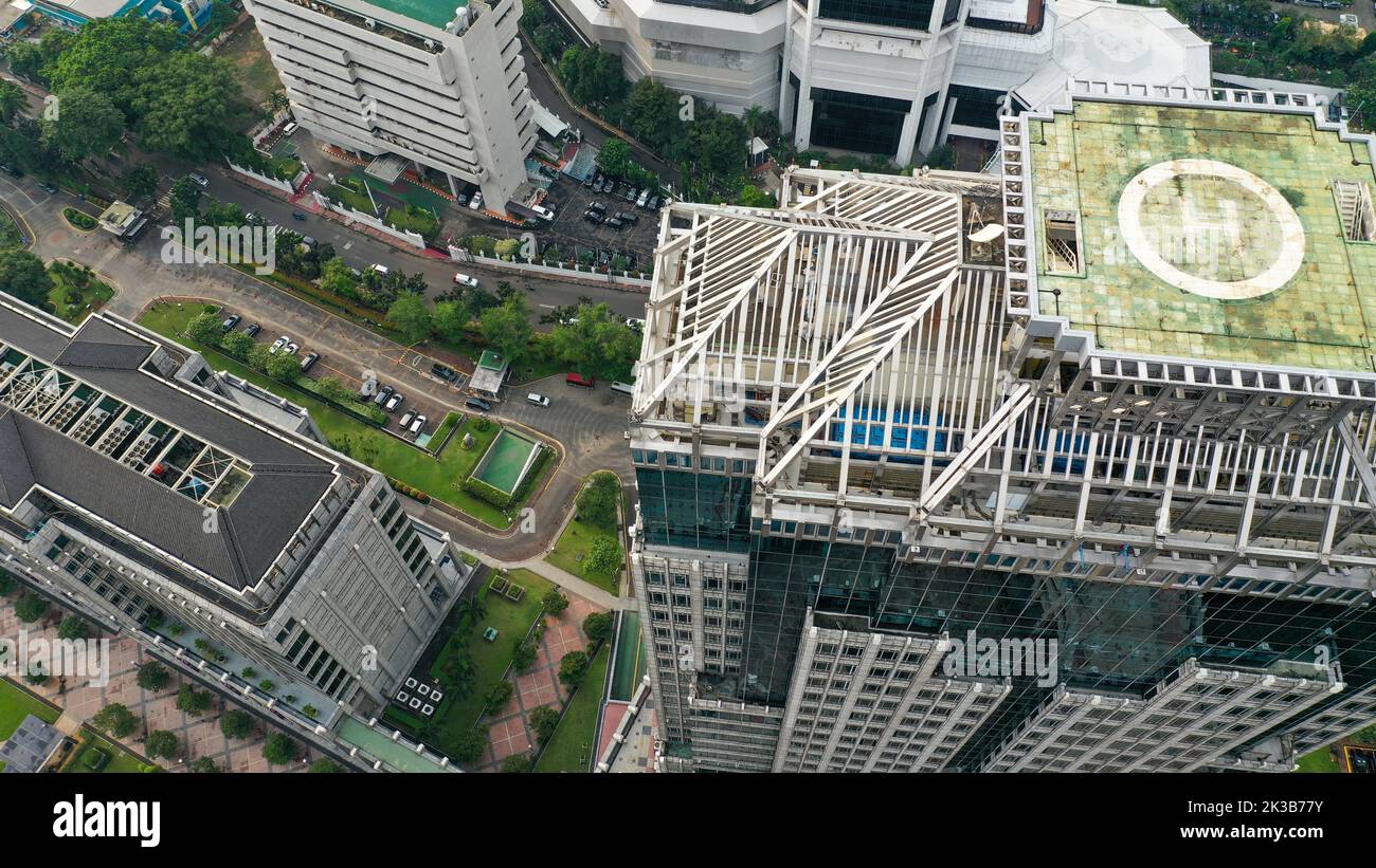 Aerial drone view of helipad on the roof of a skyscraper iin downtown ...