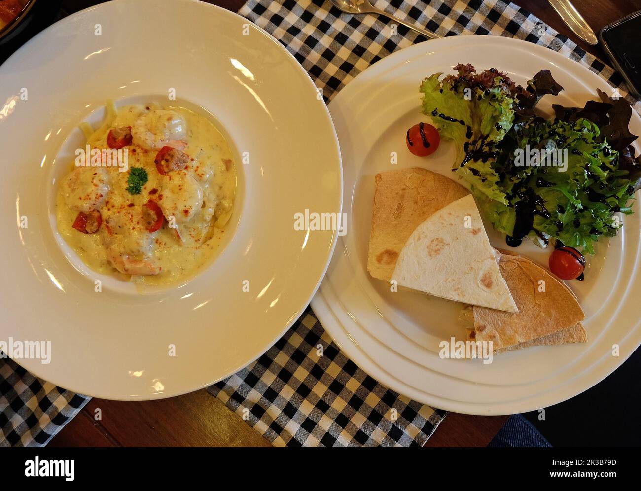Close up plate of Creamy Shrimp Carbonara pasta served with crispy ...
