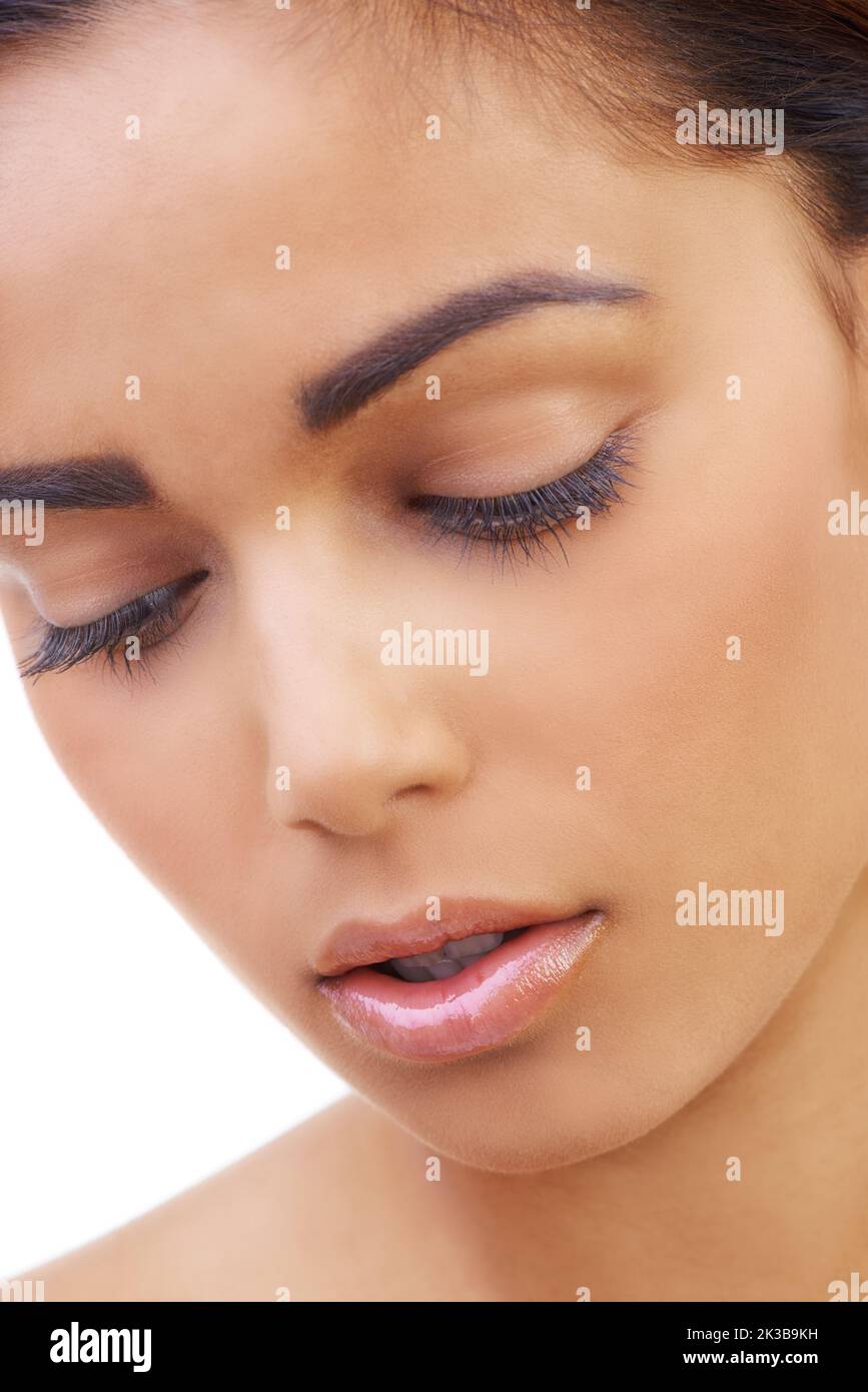 Her natural beauty is captivating. A beautiful young woman isolated on ...