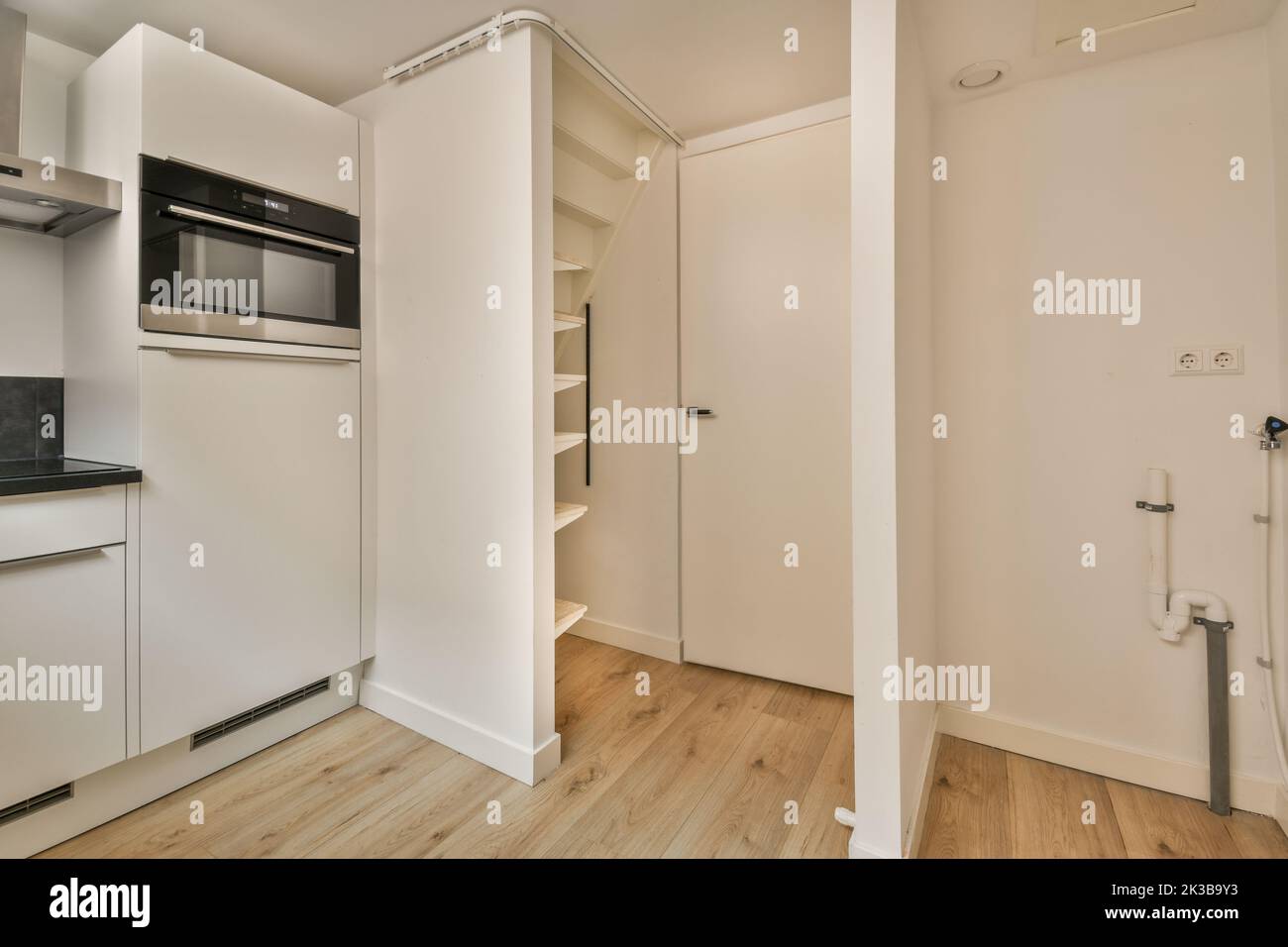 Spacious attic room of apartment near open kitchen under roof Stock ...