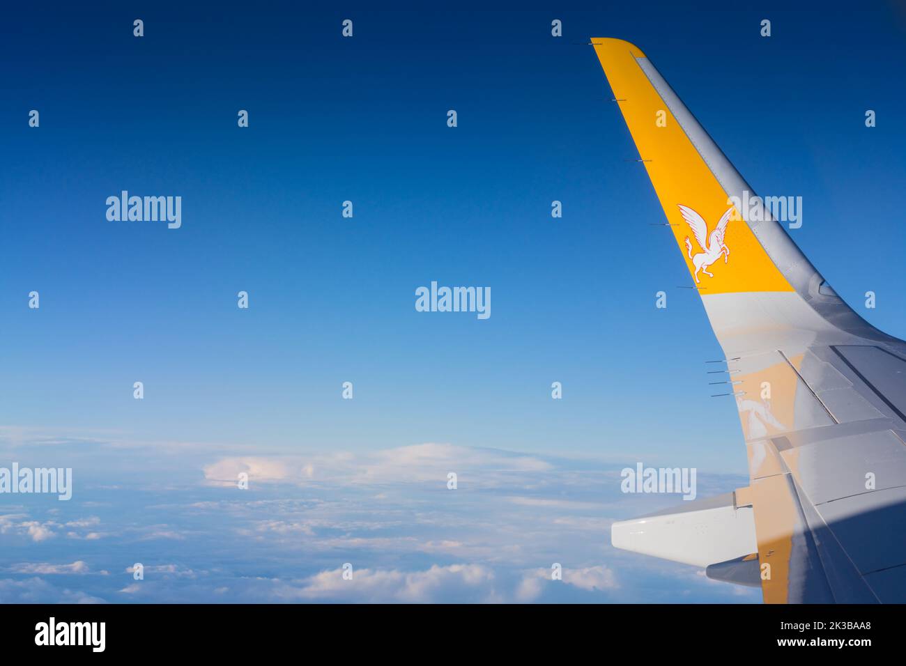 wing from a airplane with deep blue sky and clouds during a flight on ...