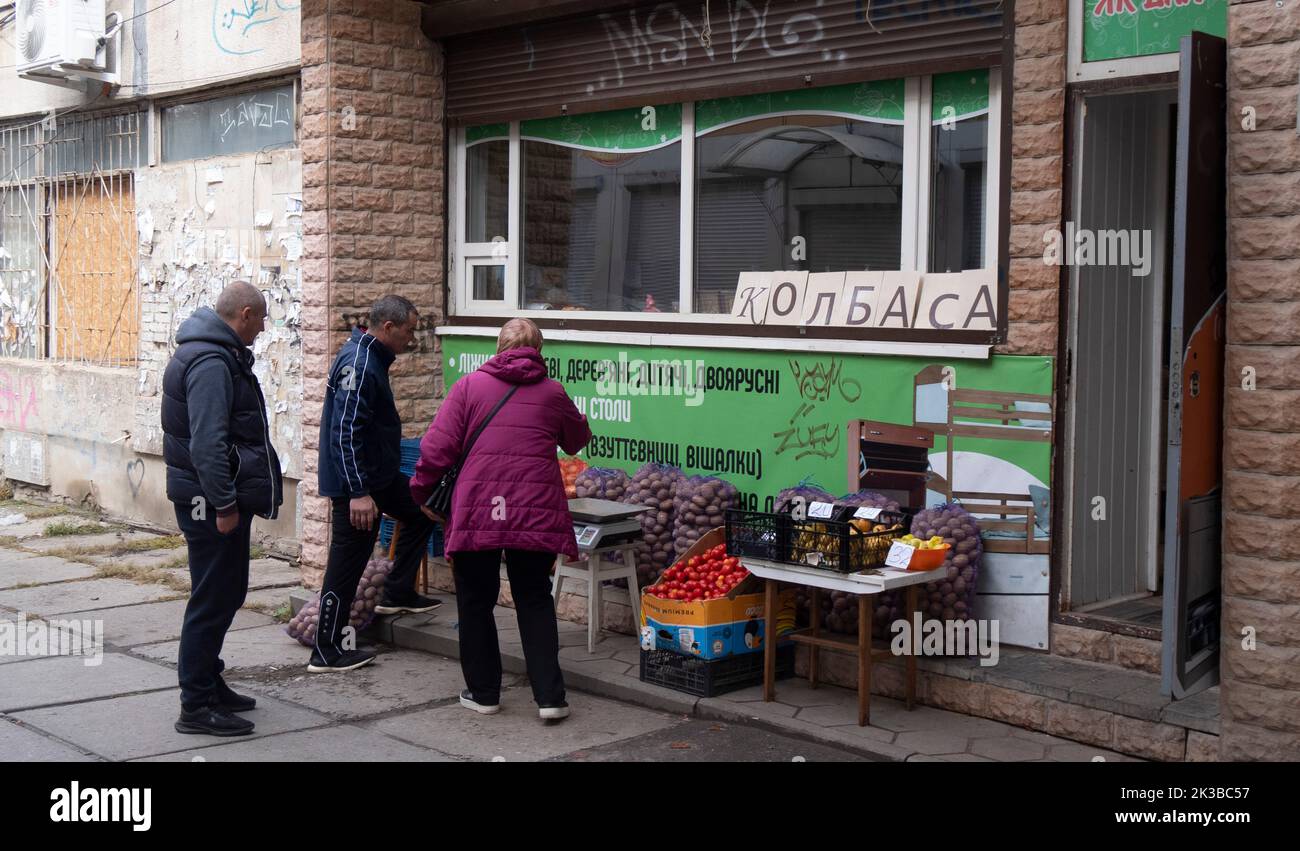 People shop at store in Kharkiv, Ukraine. Kharkiv has been under attack ...