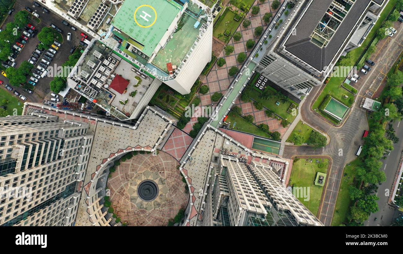 aerial top down view of a courtyard between two high rise buildings ...