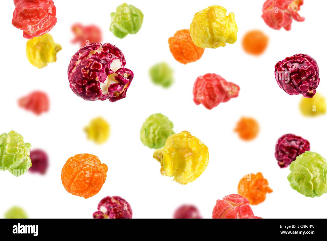 Falling Colored fruity popcorn isolated on white background, selective ...