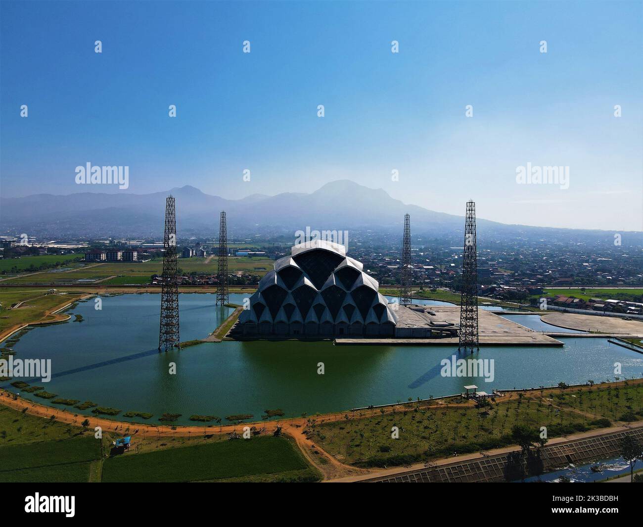 An aerial view of the Gedebage Floating mosque surrounded by water ...