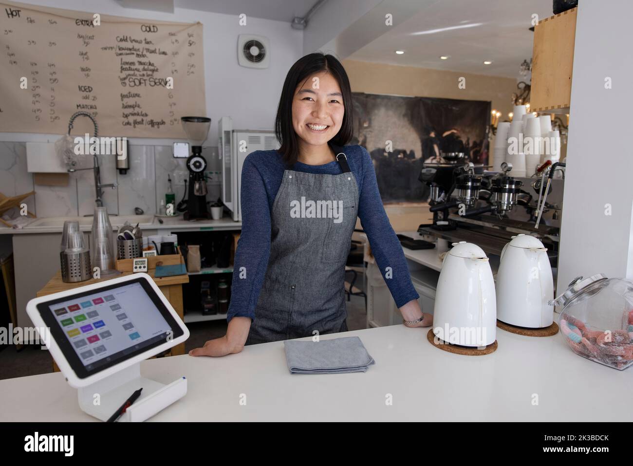 Asian cafe owner worker behind counter hi-res stock photography and ...
