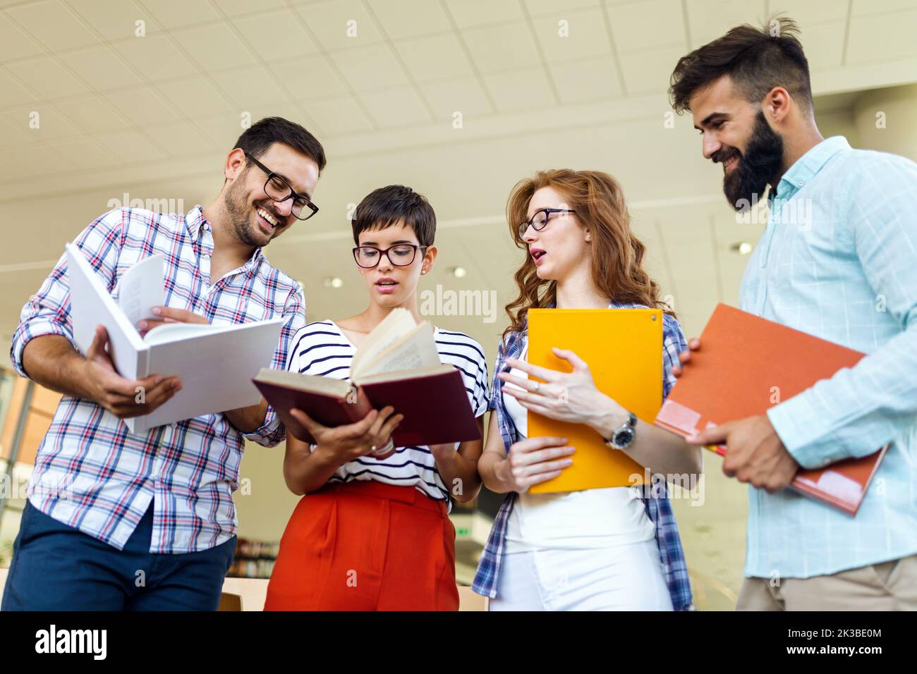 Happy group of success students studying and working together in a ...