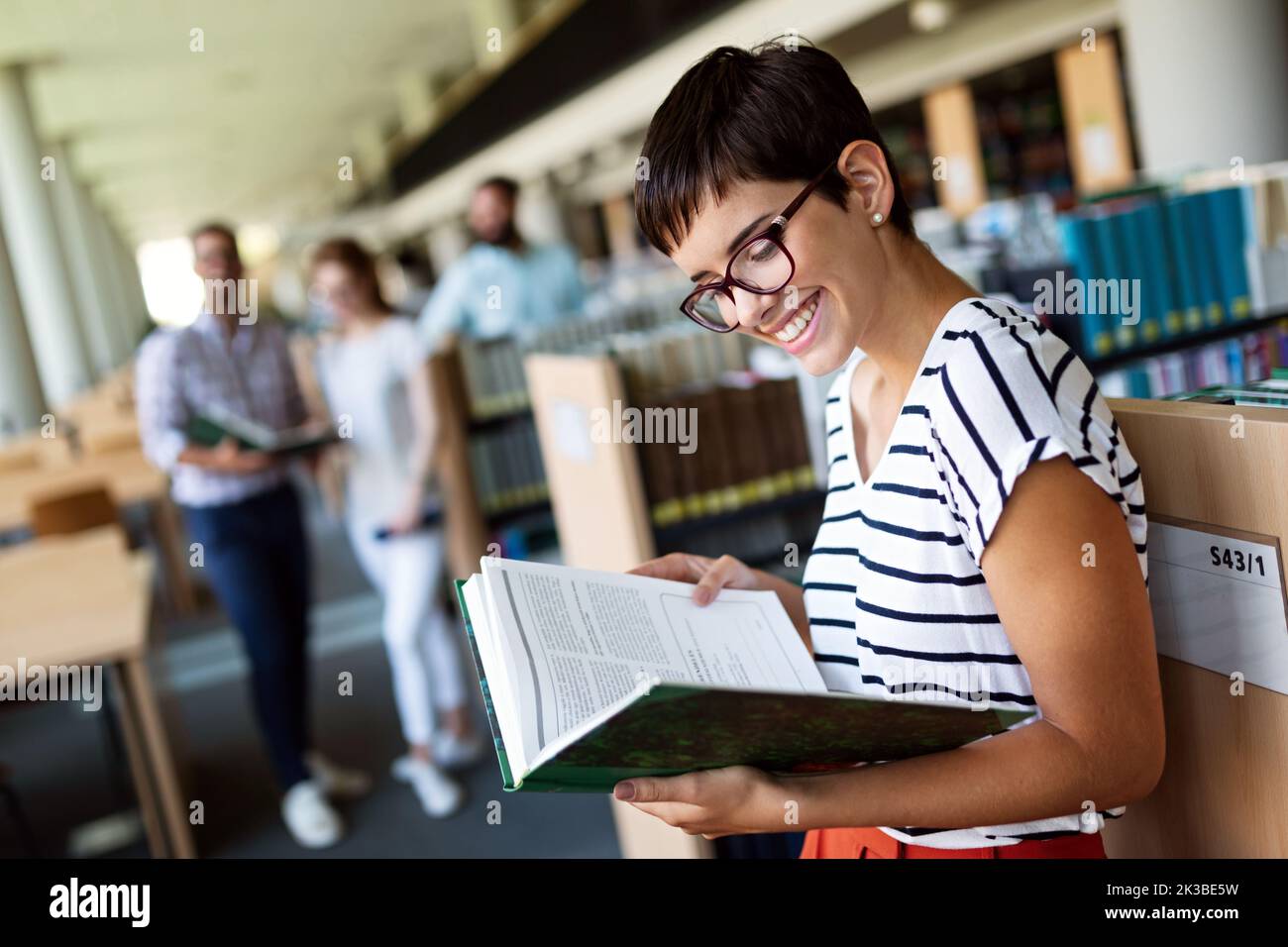 Happy group of success students studying and working together in a ...