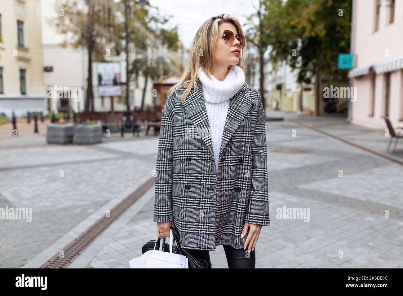 portrait of a strong woman in an autumn coat in the city Stock Photo ...