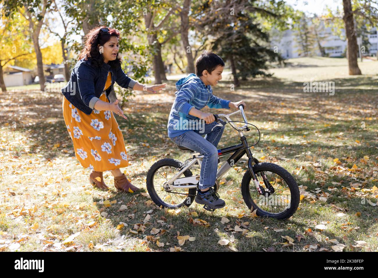 Boy learning to ride bike hi-res stock photography and images - Alamy
