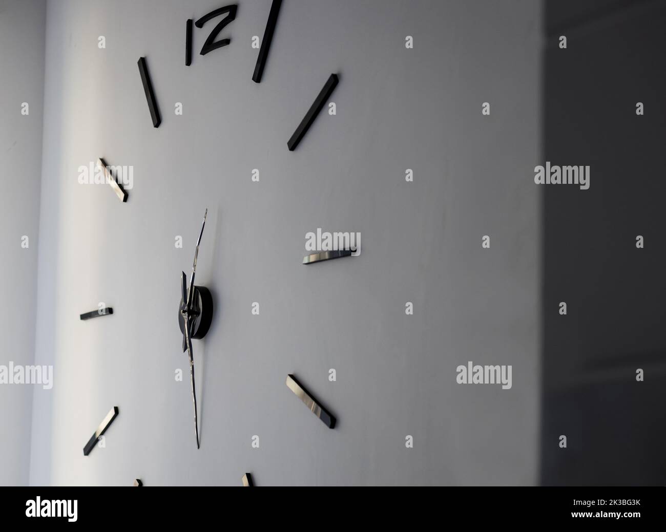 huge clock in on the wall in a modern interior. Interior Design Stock ...