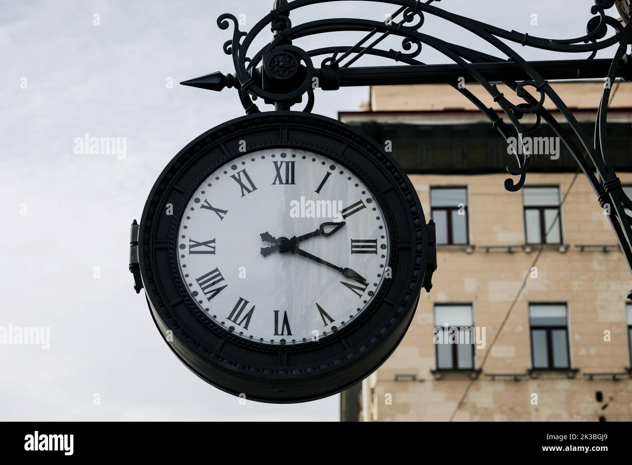 Vintage street clock in European town Stock Photo - Alamy