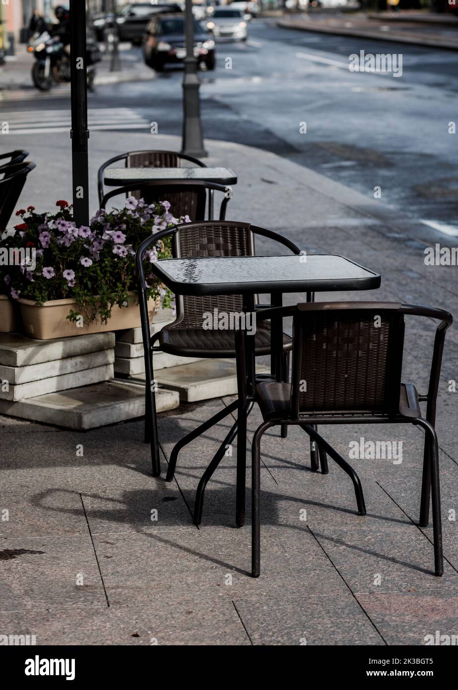 table and chairs at a sidewalk cafe. cozy street restaurant Stock Photo ...