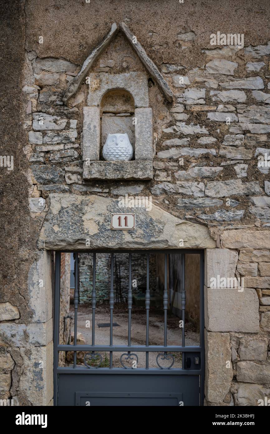 A stone carved owl guards the gateway of a family property close to ...