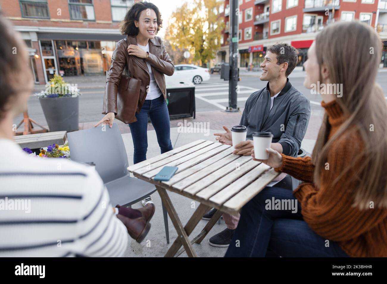Man woman greeting friends hi-res stock photography and images - Alamy