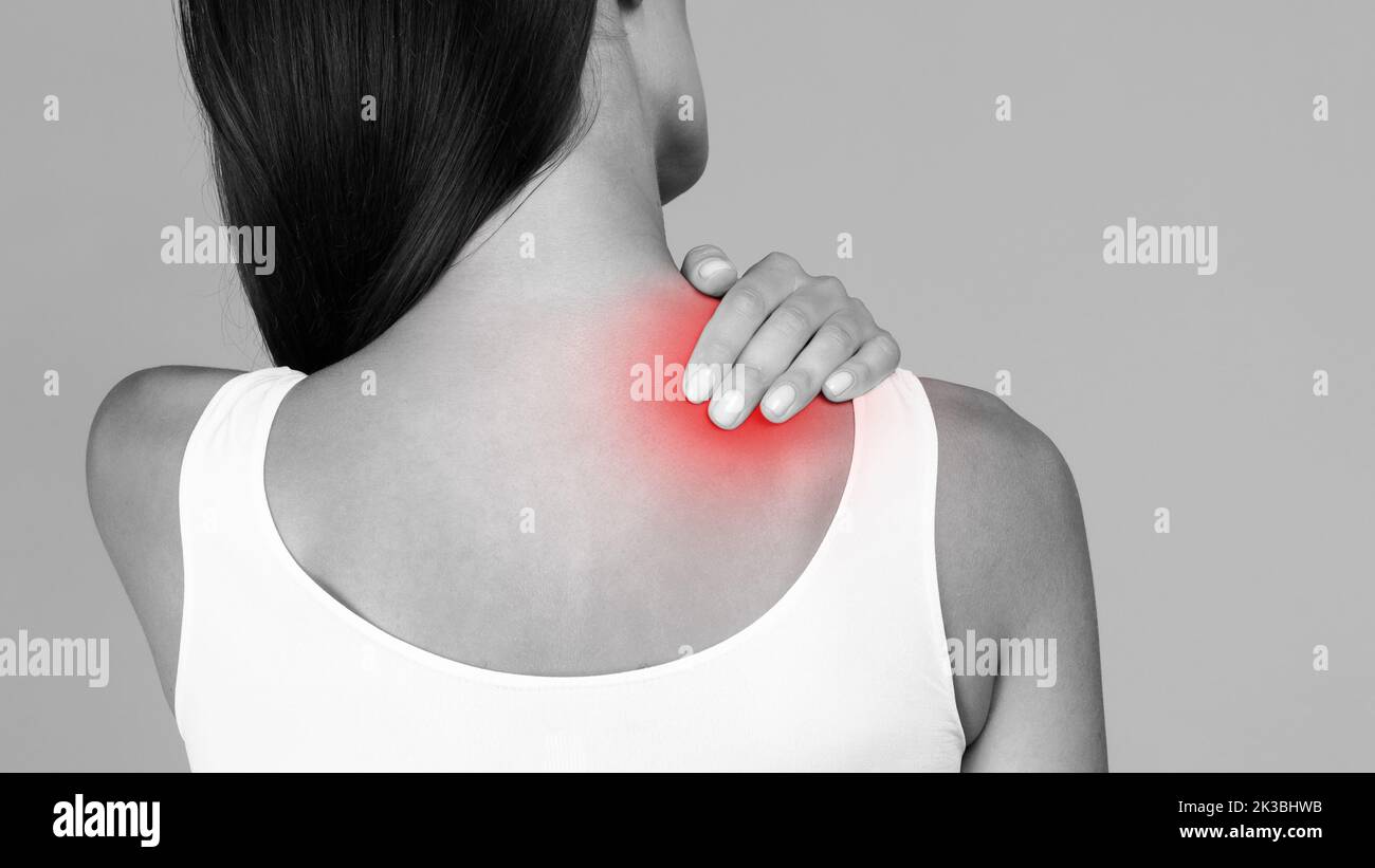 Black and white photo of woman having strong pain in her back ...