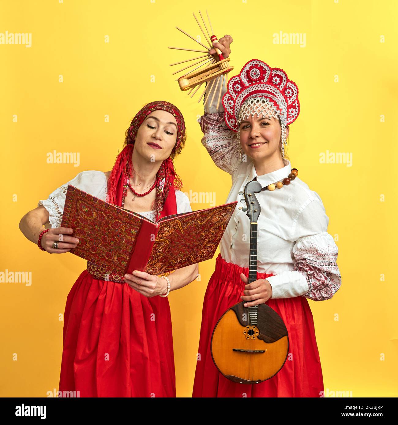 Women musicians in Russian folk dresses with musical instruments on a ...