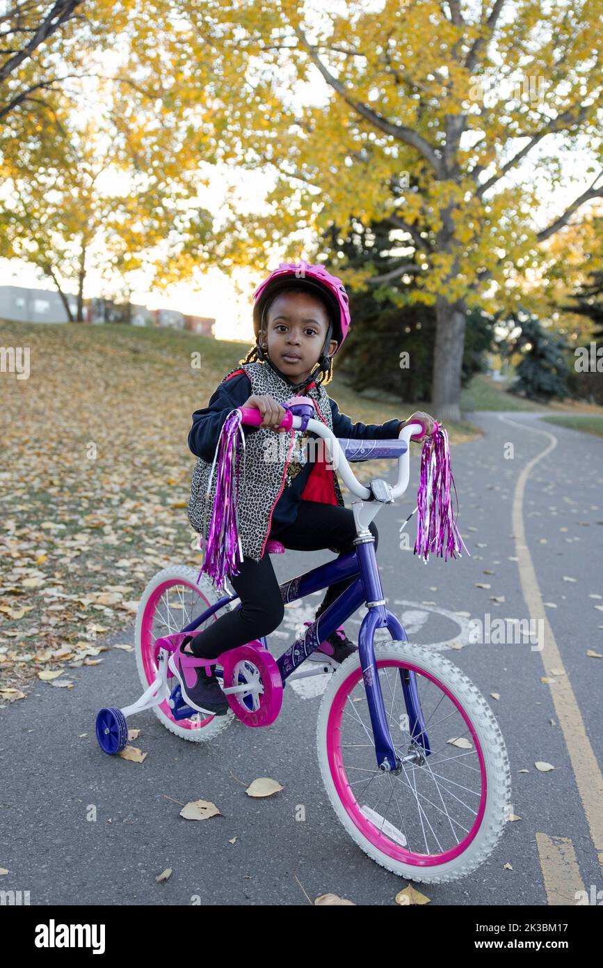 Cute girl on bike hi-res stock photography and images - Alamy