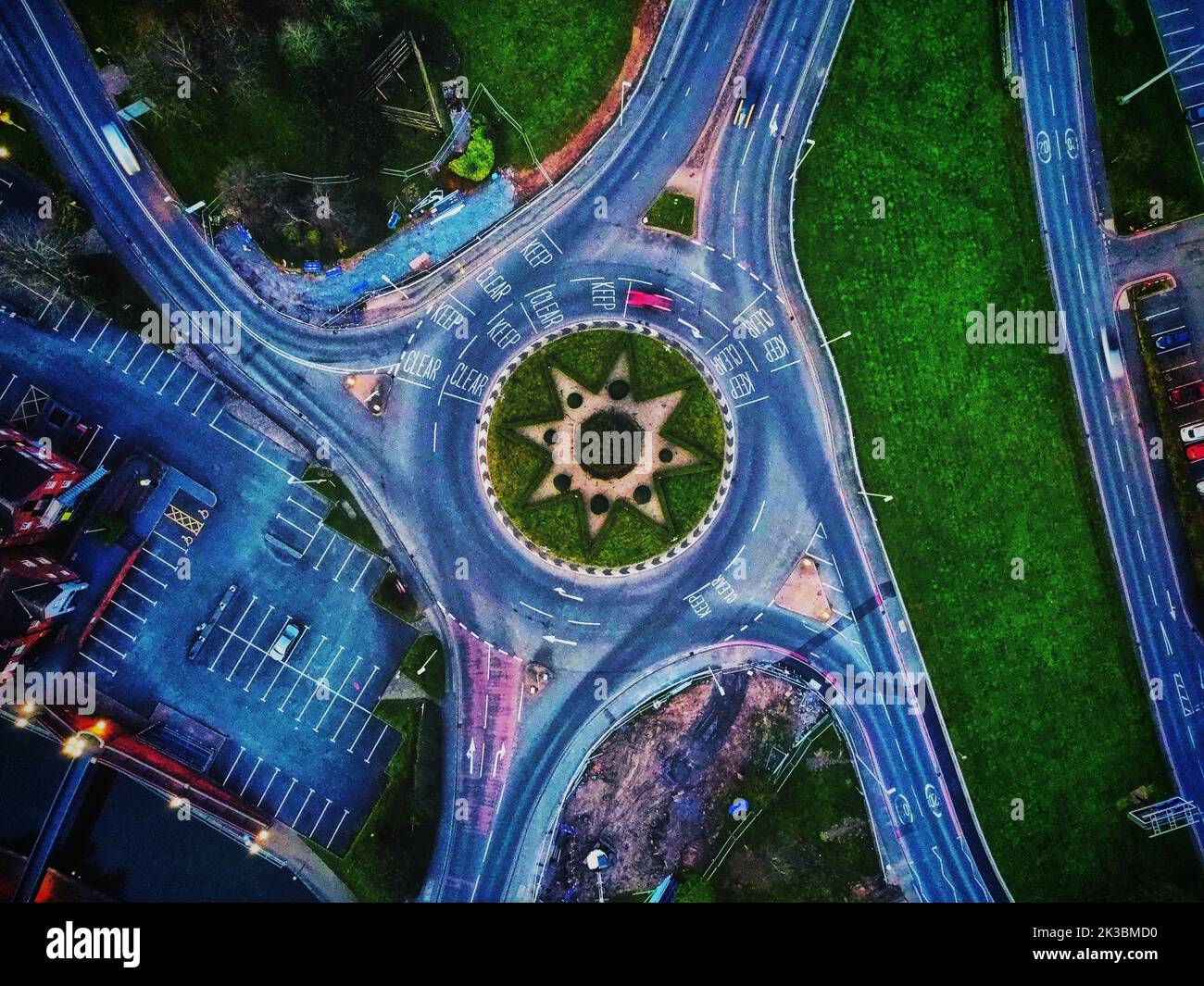 An aerial view of a roundabout decorated with beautiful plants in the middle Stock Photo - Alamy