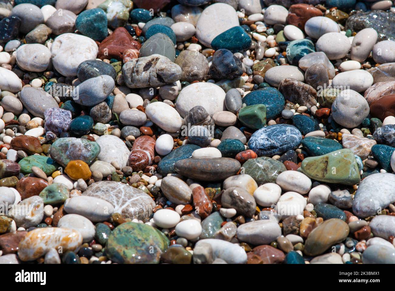 colored pebbles on the beach Stock Photo - Alamy