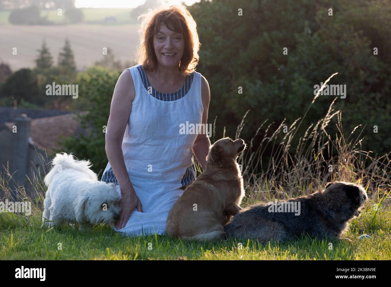 Woman Happy Smiling with three dogs Stock Photo - Alamy